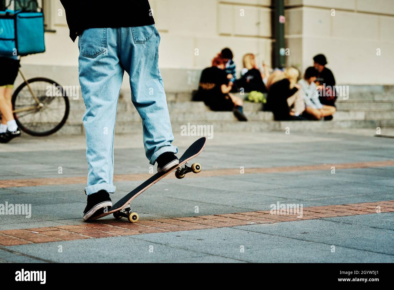 Skateboarder ride on skateboard at city street. Scater practice skate ...