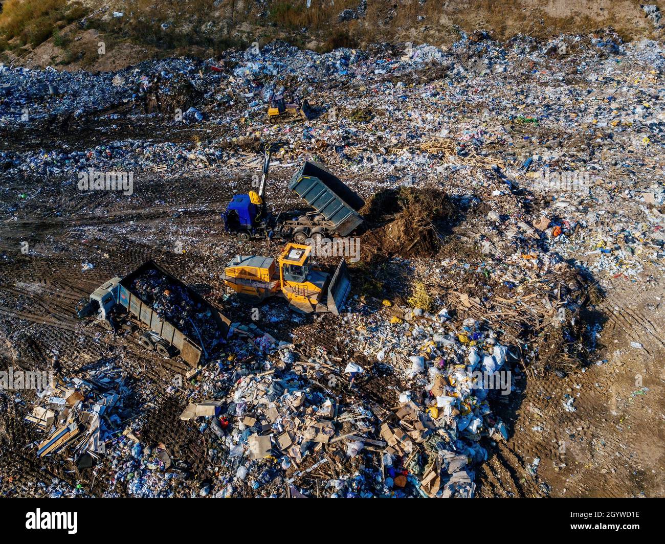 Garbage dump and working dump truck and bulldozer, aerial view Stock ...