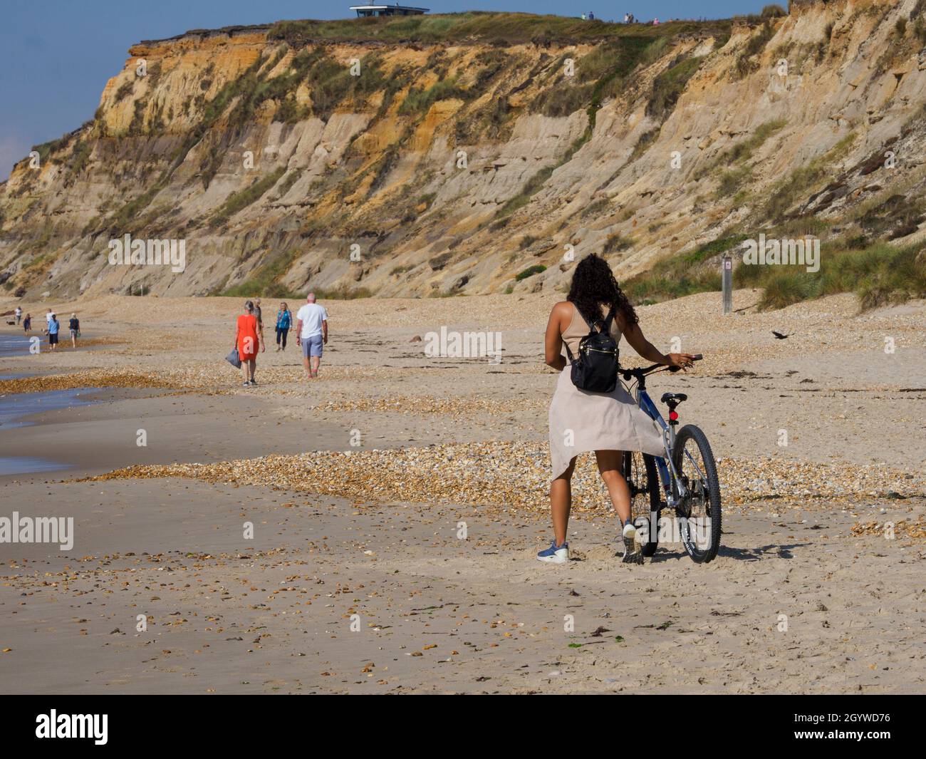 Woman pushing her bicycle hi-res stock photography and images - Alamy