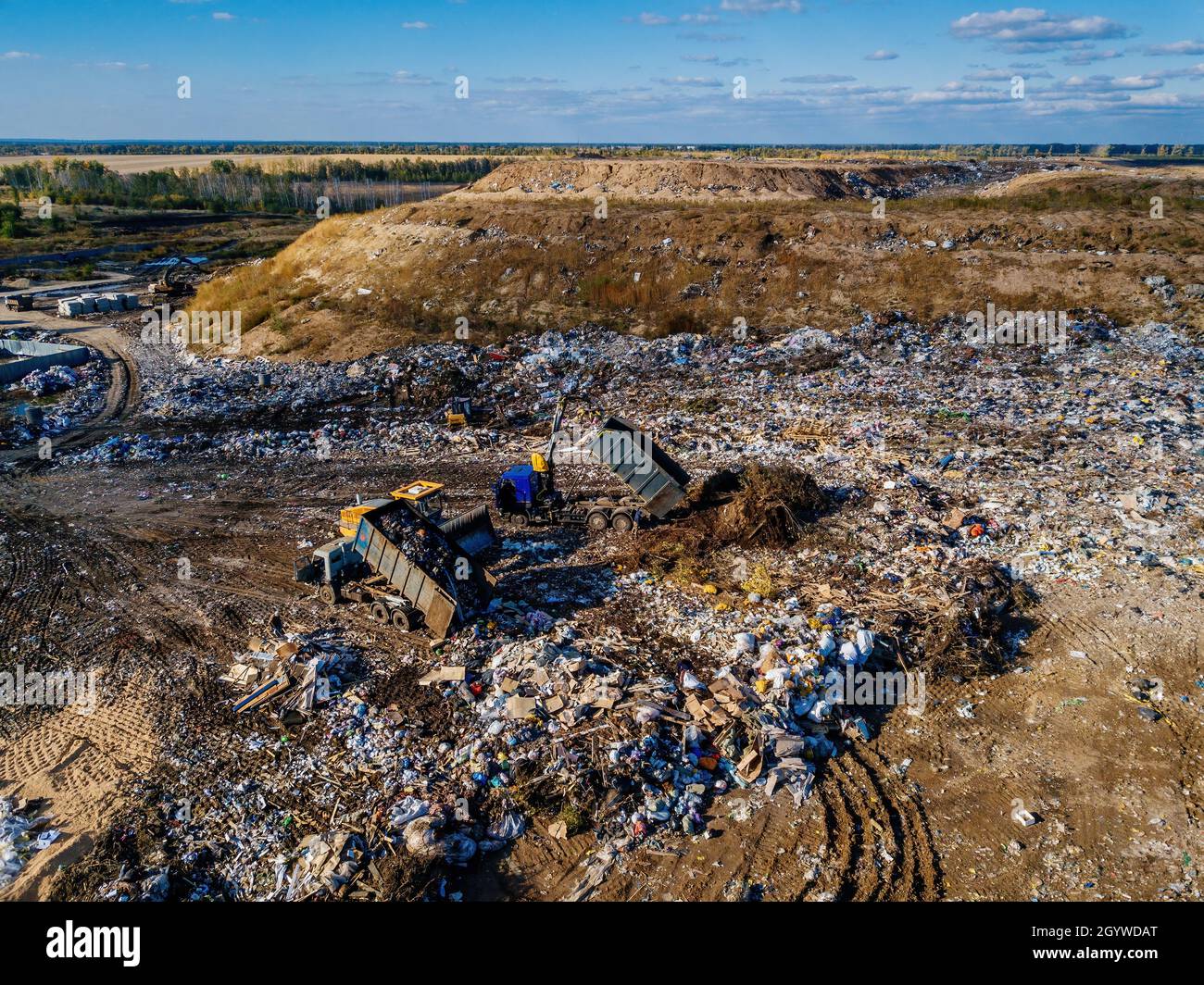 Garbage dump and working dump truck and bulldozer, aerial view Stock ...