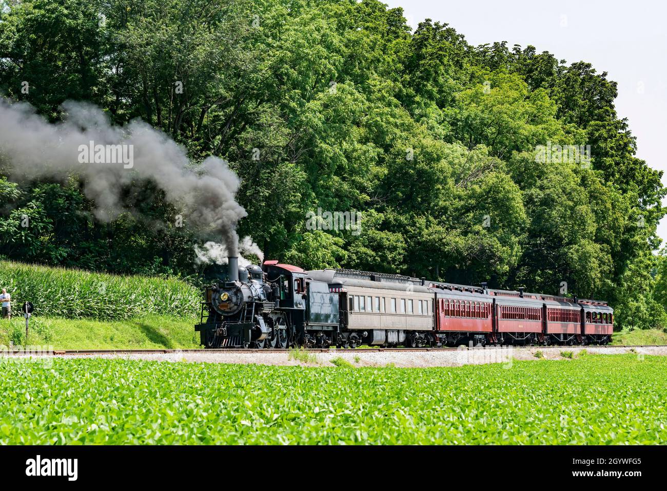 View of an Antique Restored Steam Passenger Train Blowing Smoke and ...