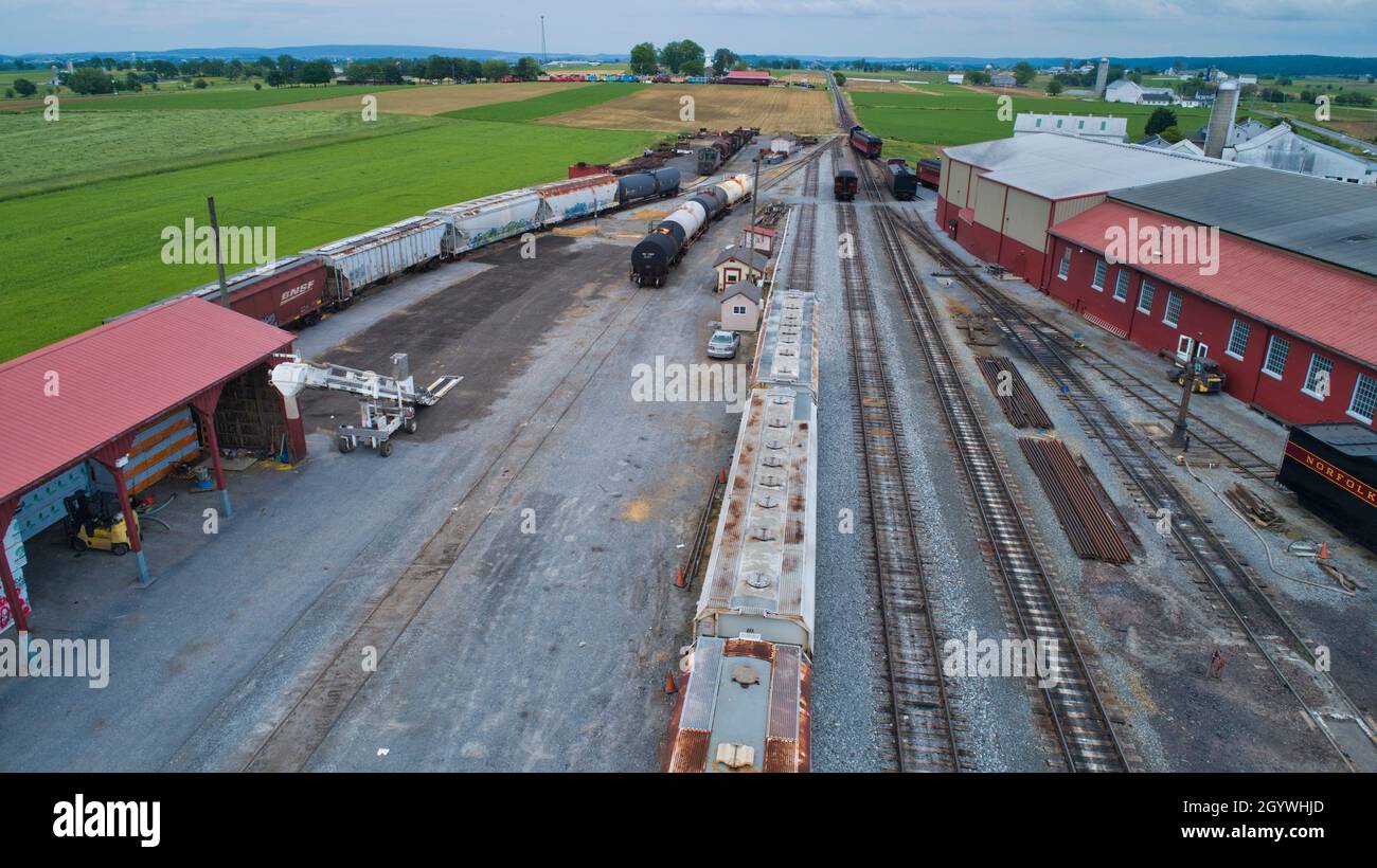 Aerial View of a Freight Yard With An Antique Steam Engine and Freight ...