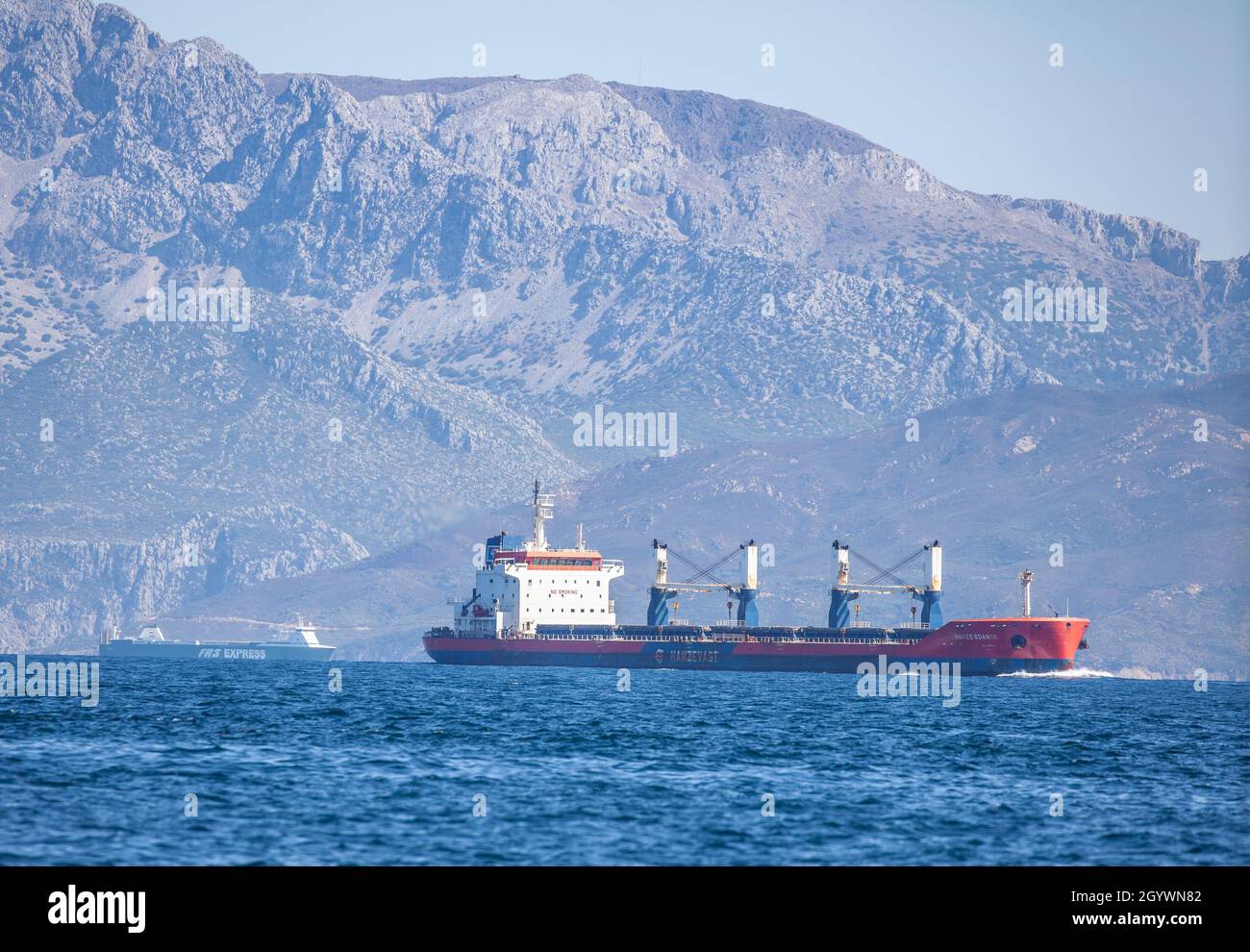 A Bulk Carrier and an express ferry in the Strait of Gibraltar between ...