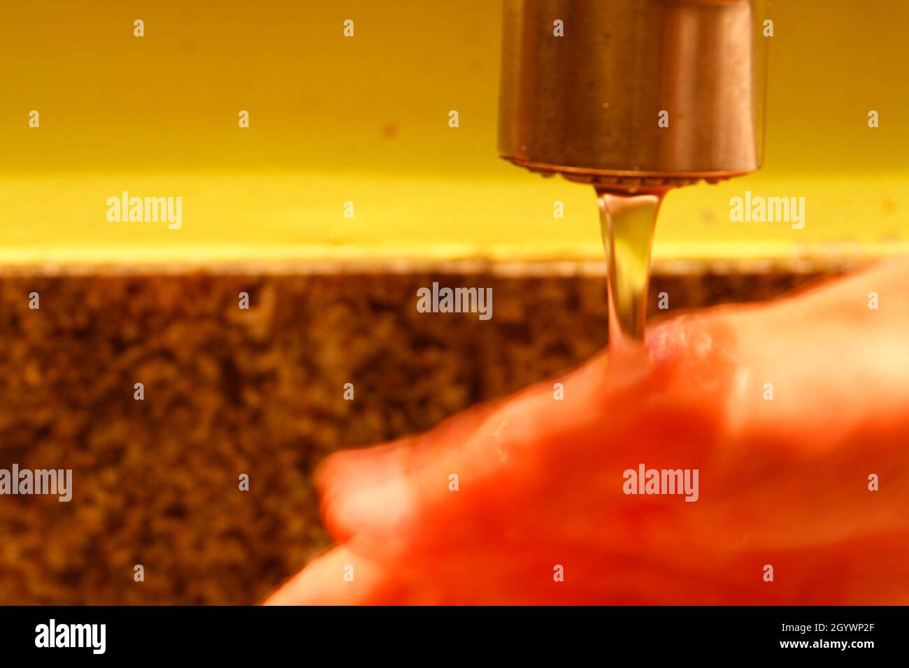 Long Exposure of Water Running Off a Hand Stock Photo - Alamy
