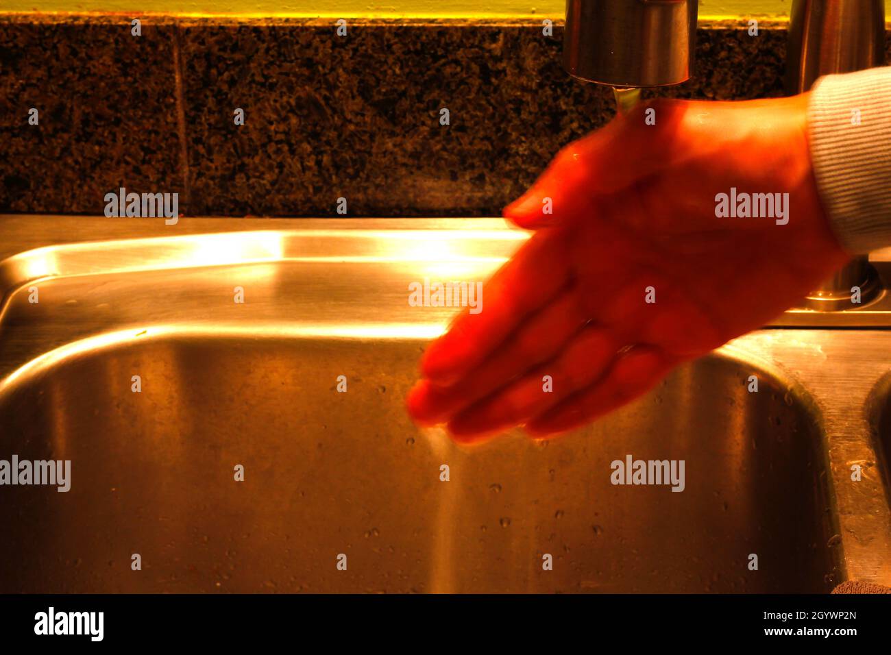 Long Exposure of Water Running Off a Hand Stock Photo - Alamy