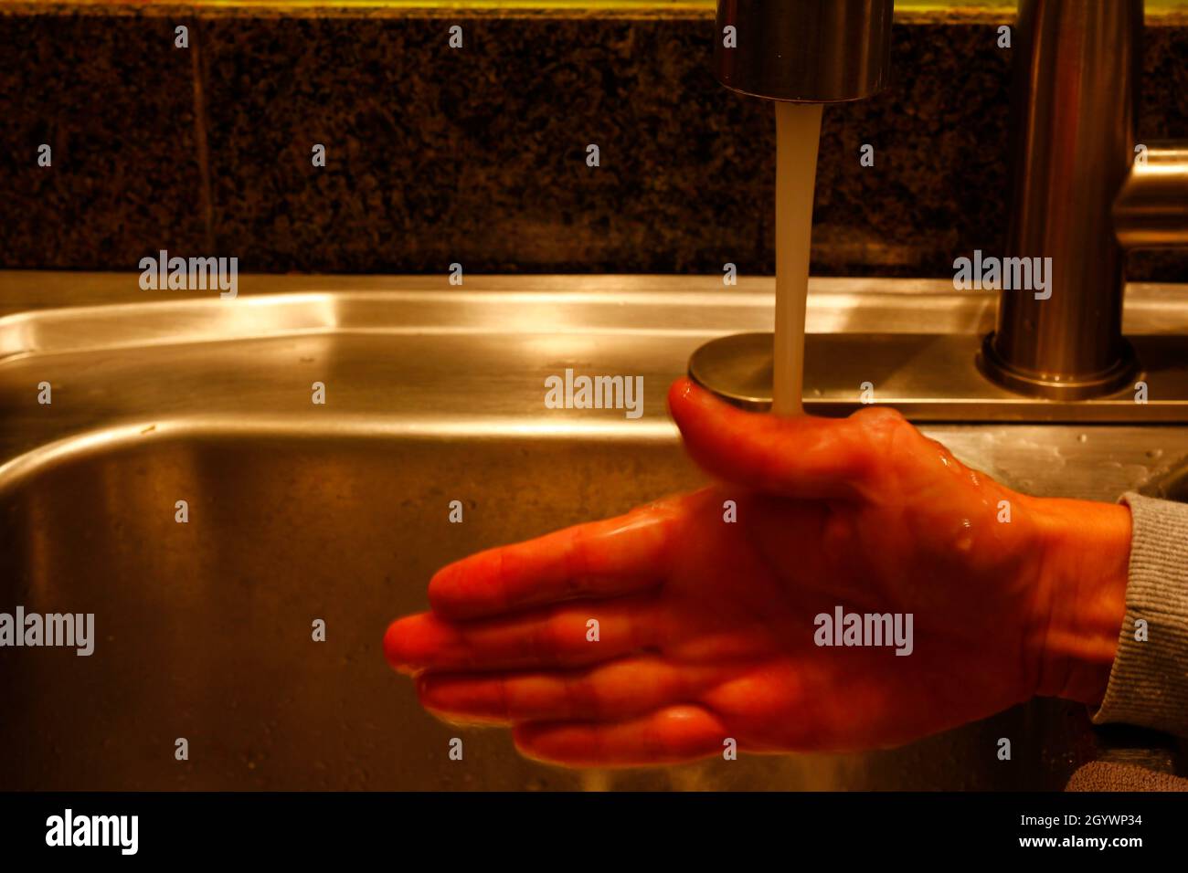 Long Exposure of Water Running Off a Hand Stock Photo - Alamy