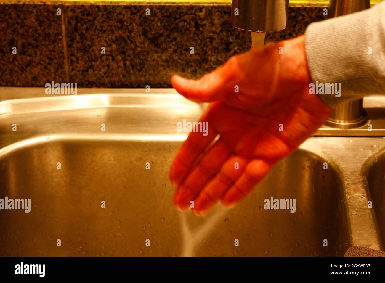 Long Exposure of Water Running Off a Hand Stock Photo - Alamy