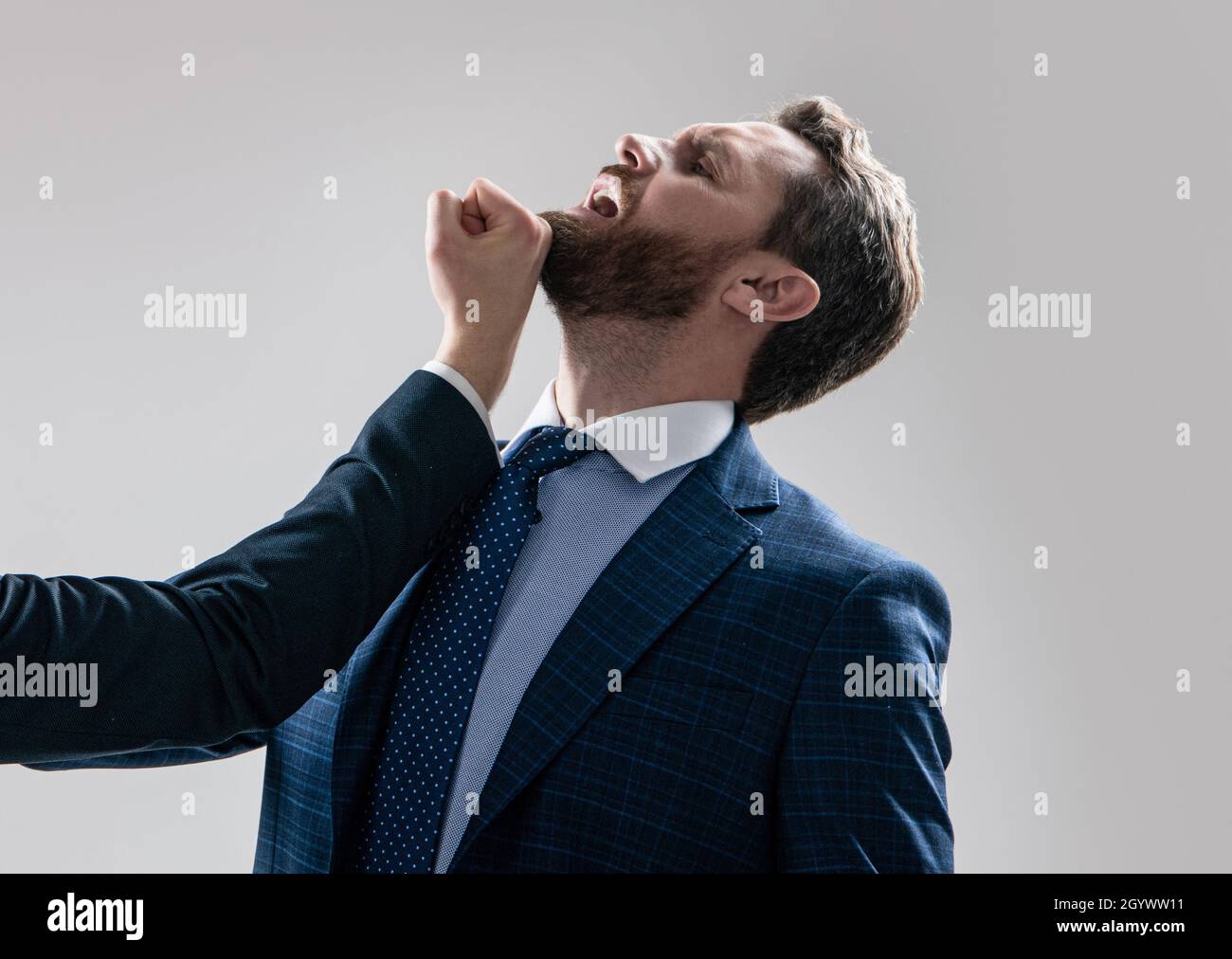 Professional man manager in suit got blow jaw punch fisticuff ...