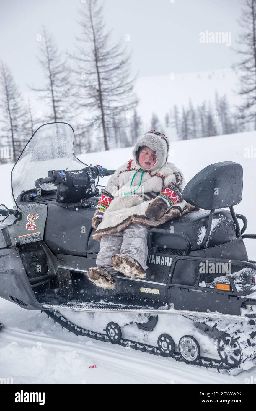 Girl on snowmobile hi-res stock photography and images - Alamy