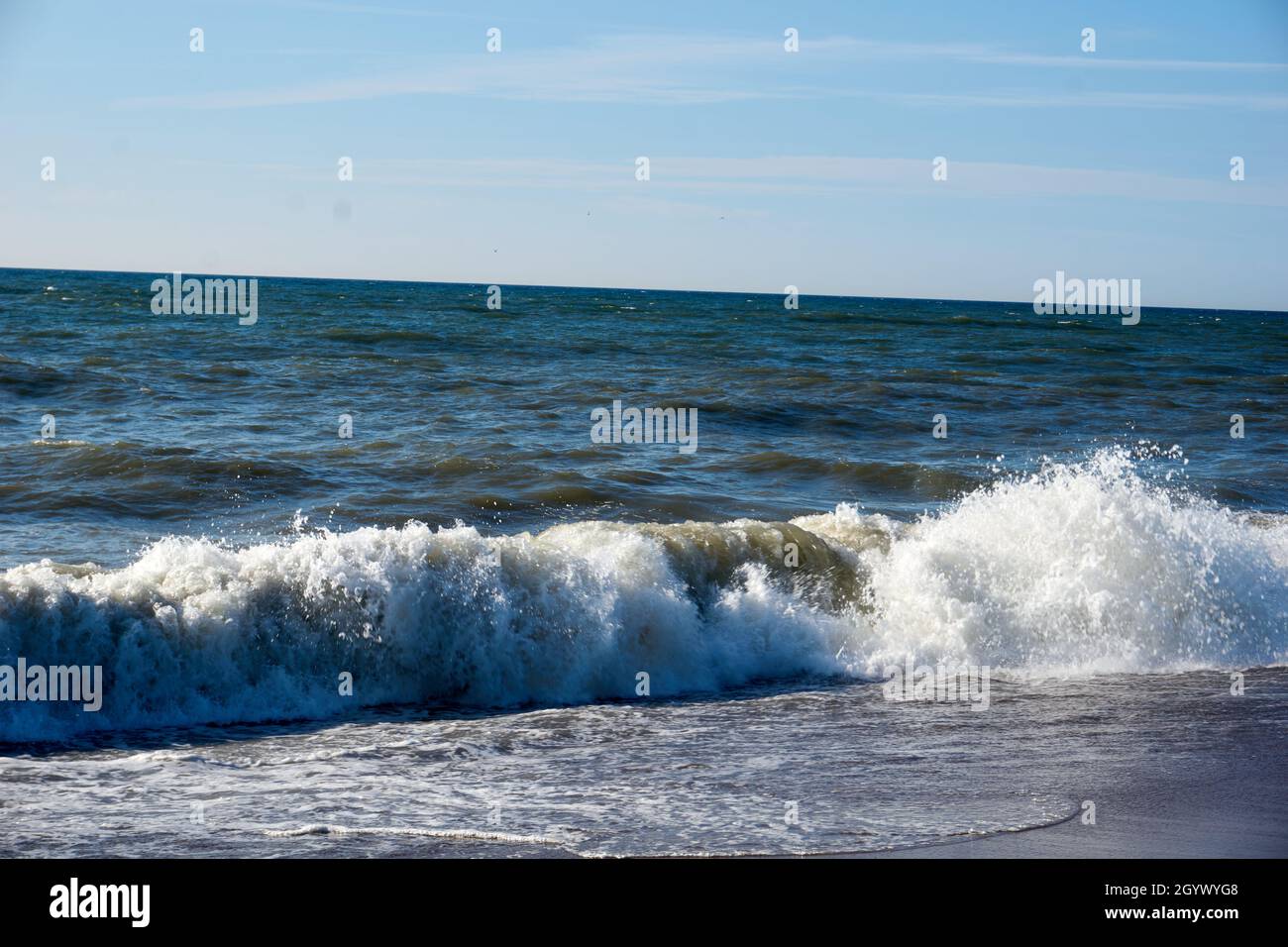 Beautiful view of the wavy sea under the blue sky on a sunny day Stock ...