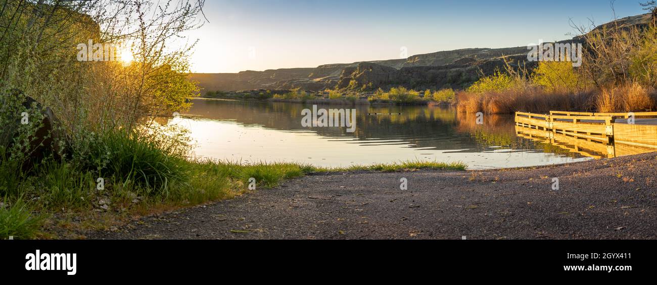 Deep Lake Boat Launch Dock Glows at Sunrise in Sun Lakes State Park ...