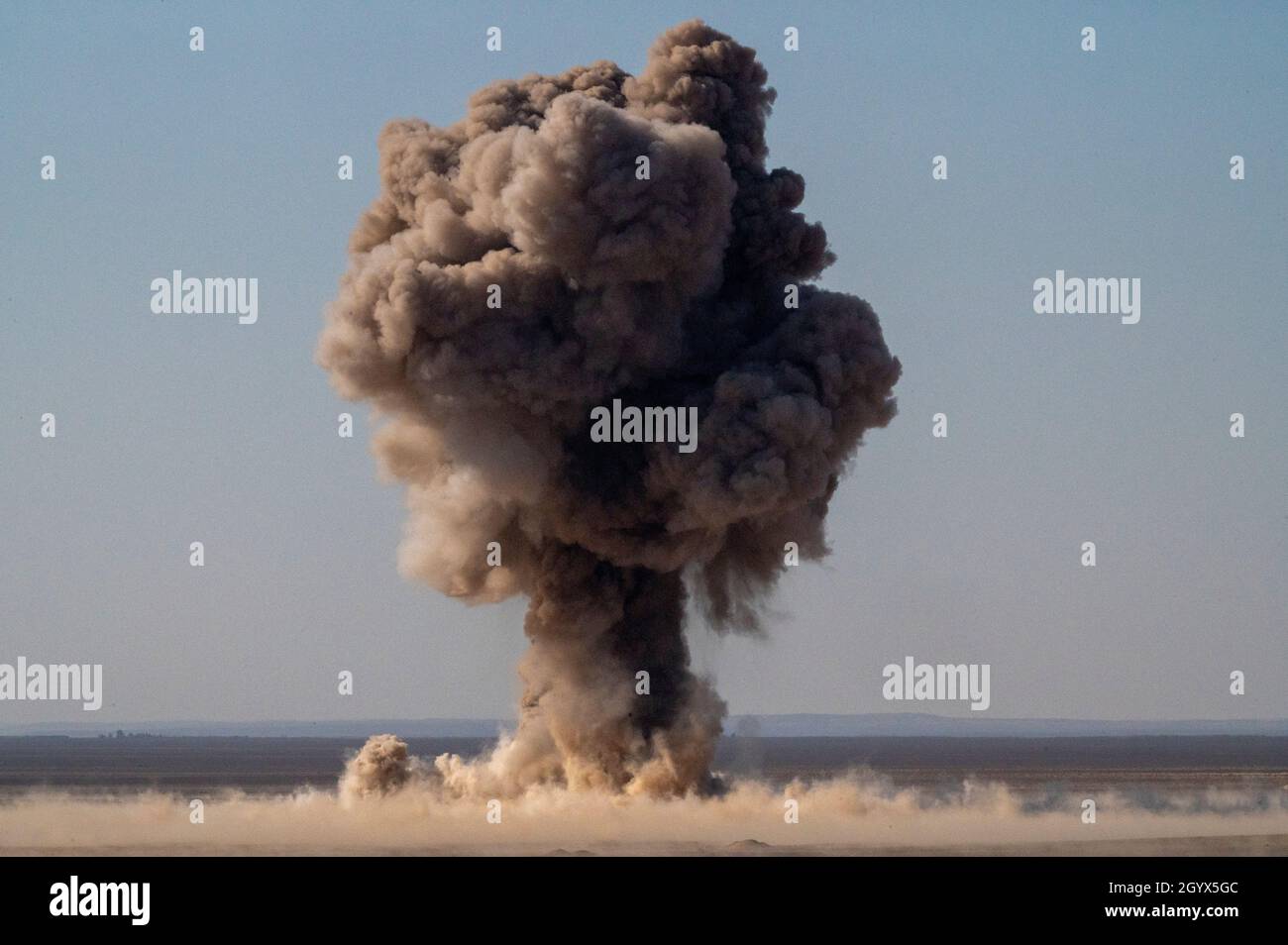 F-15E Strike Eagles offload general purpose bombs for training at a ...