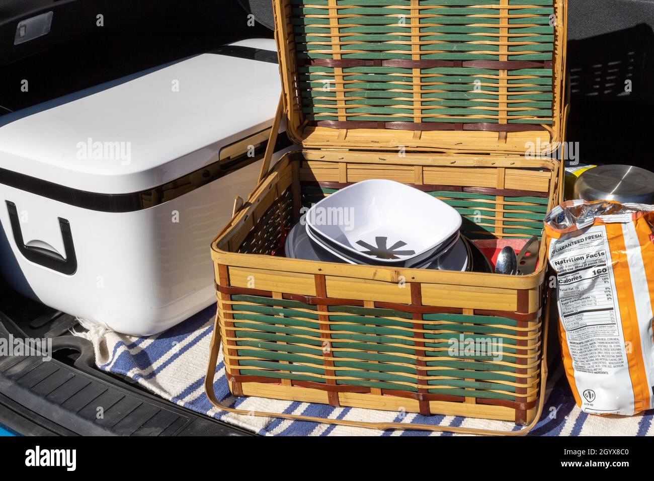 Picnic Basket with Snacks and a Cooler in the Trunk Boot of a Car Stock ...