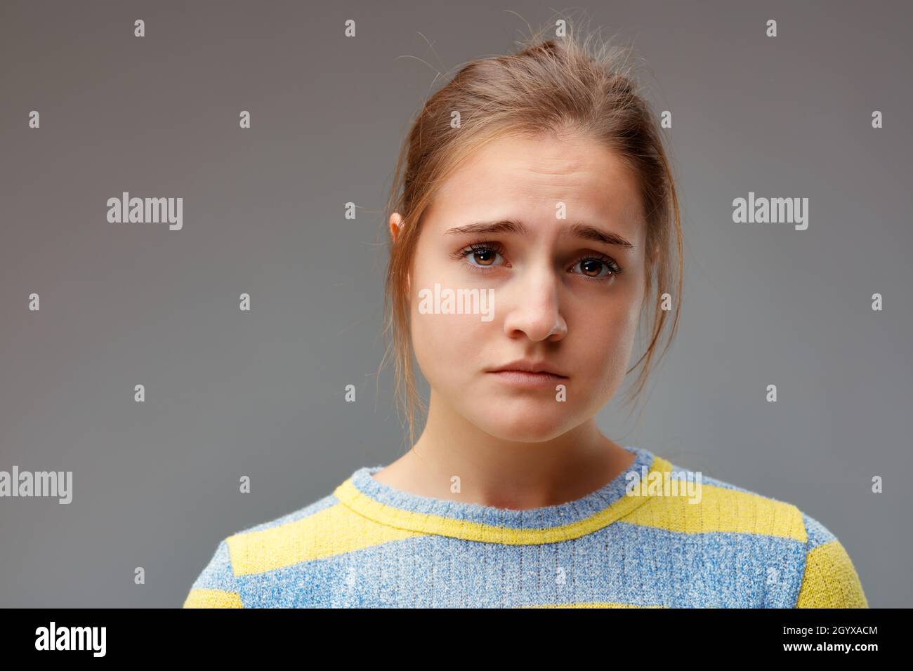 How sad! Young woman with expression of sadness and disappointment ...
