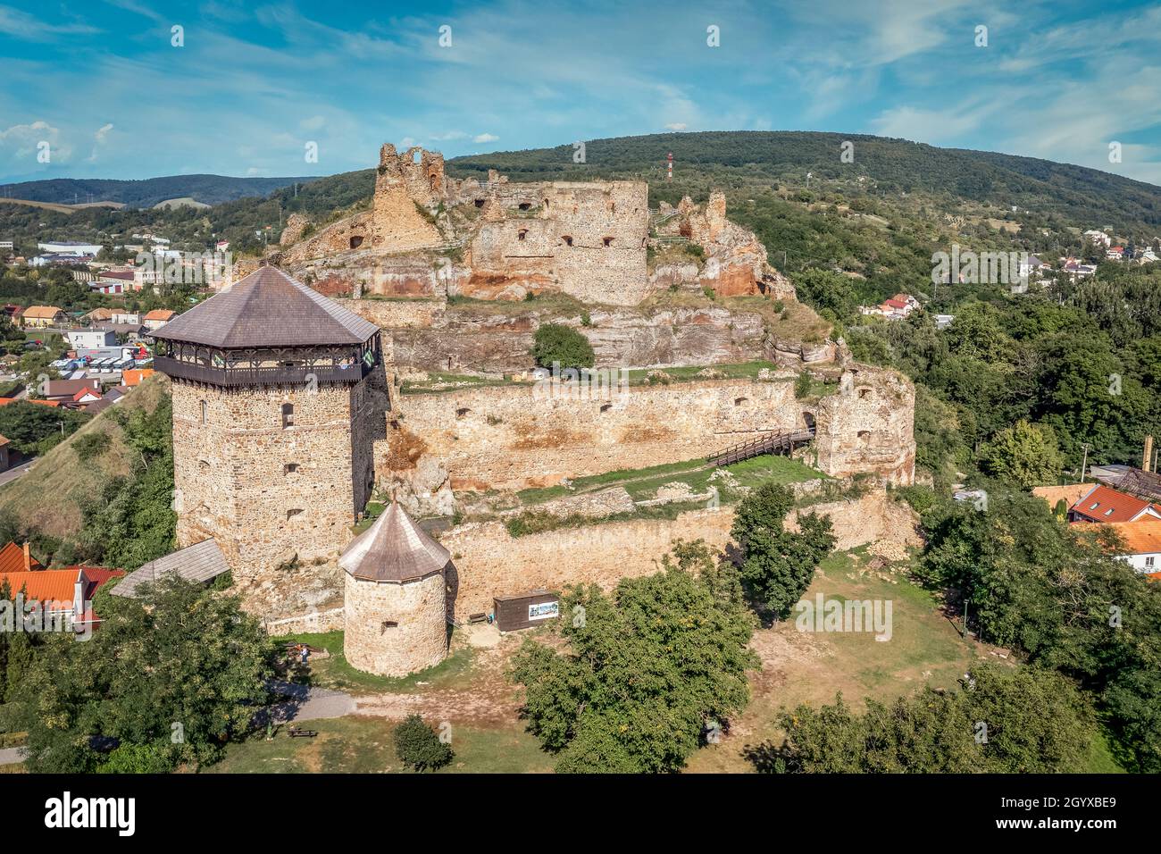 Aerial view of partially restored medieval Filakovo Fulek castle in ...