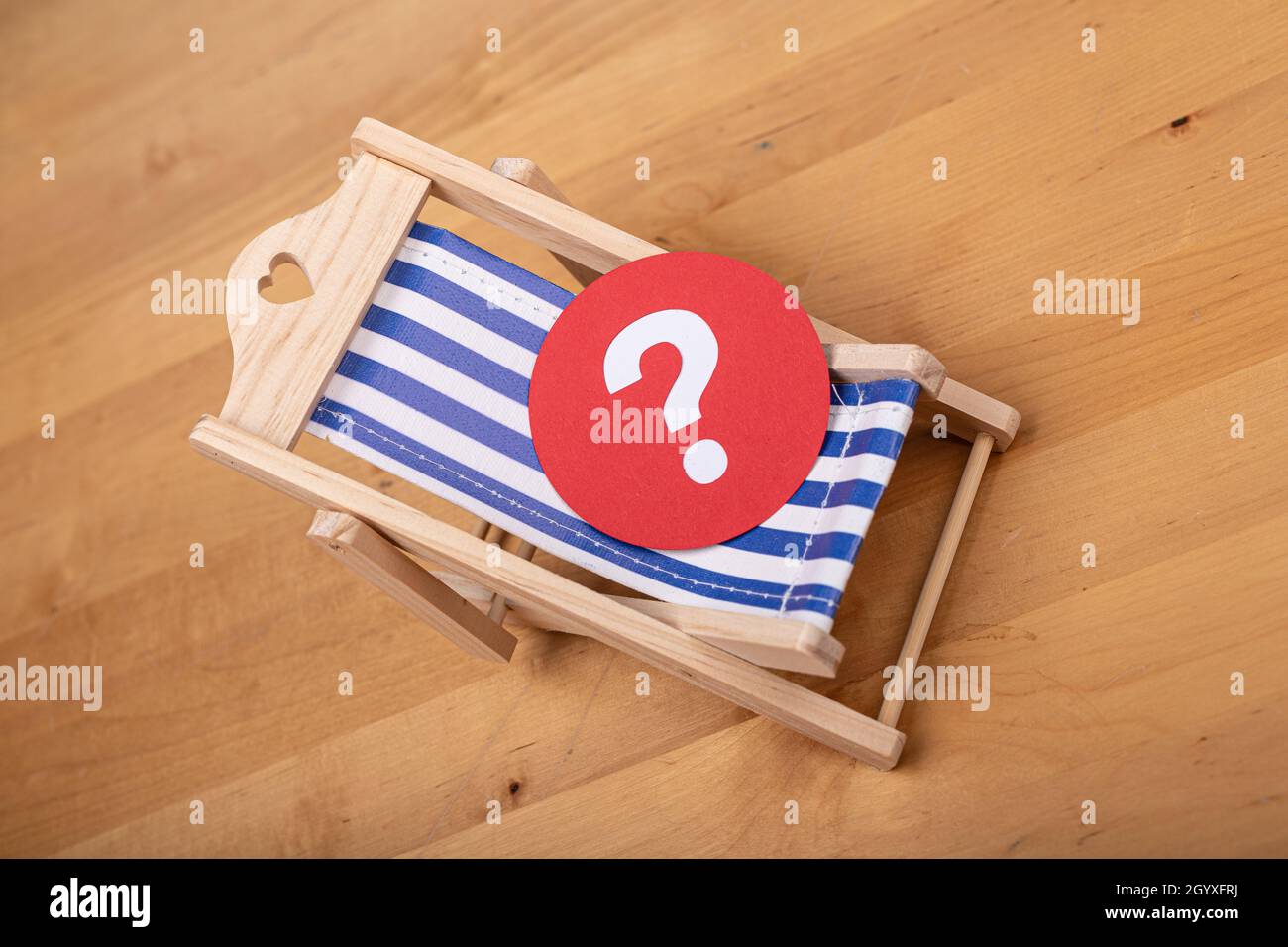 A 3D rendering of a beach chair with question mark- beach summer ...