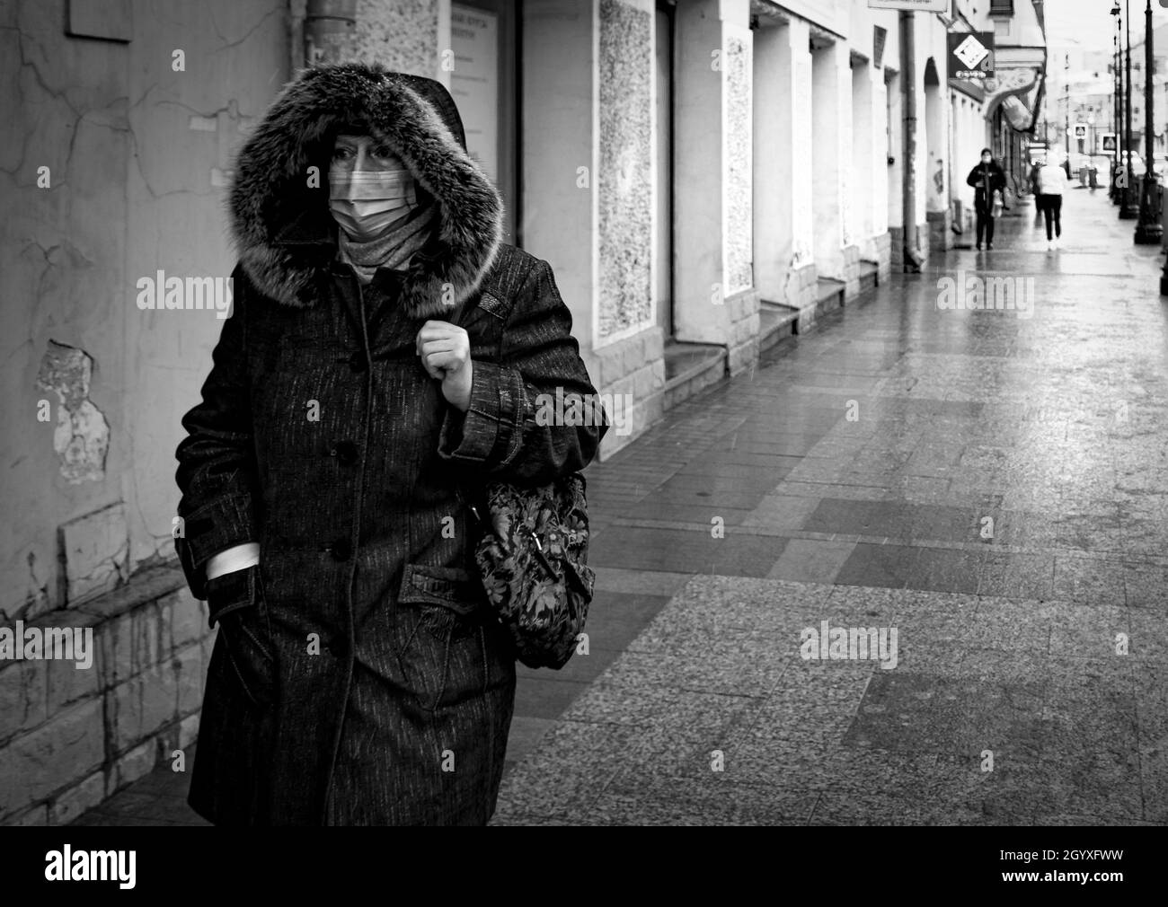26th of October 2020, Tomsk, Russia: woman walks down the street in ...
