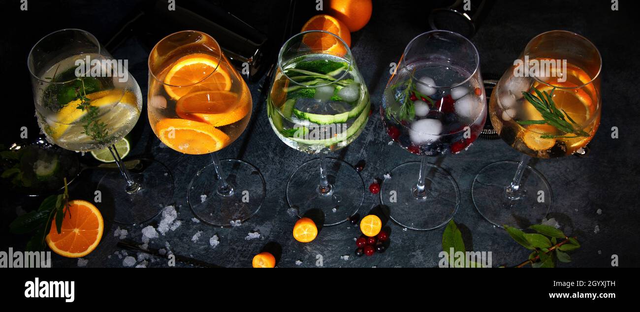 Gin cocktails assortment served on dark background. Creative drinks ...