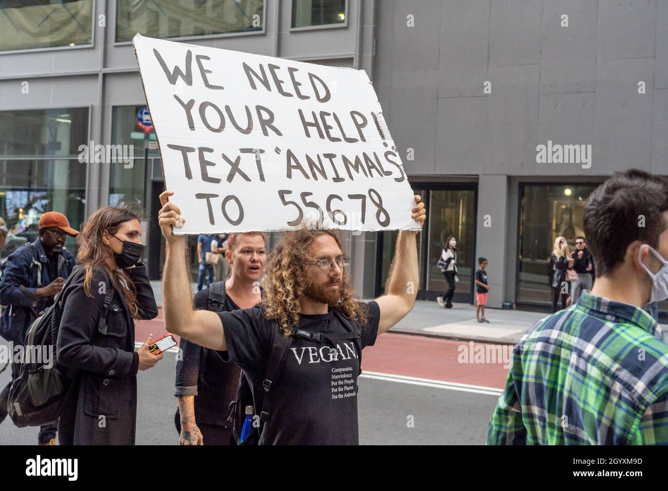 NEW YORK, NY - OCTOBER 9: Animal rights activist holds a sign reading ...