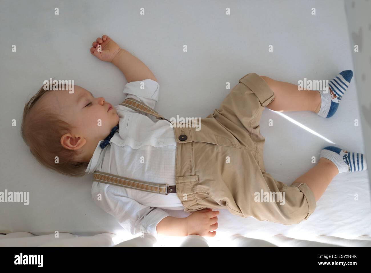 Portrait of cute little baby sleeping in his crib Stock Photo - Alamy