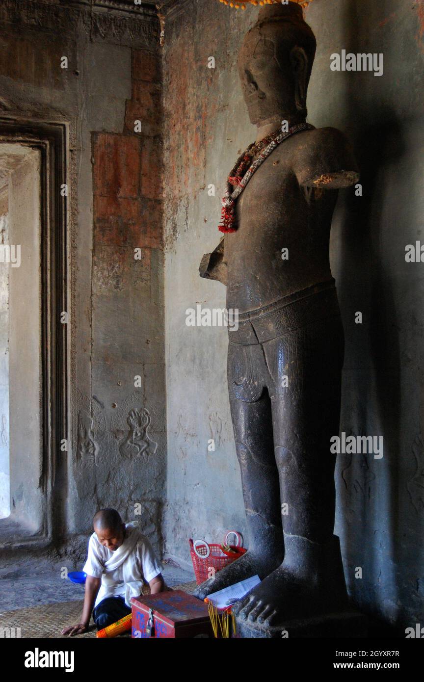 Hindu god Vishnu deity angel god statue with pilgrim nun cambodian ...