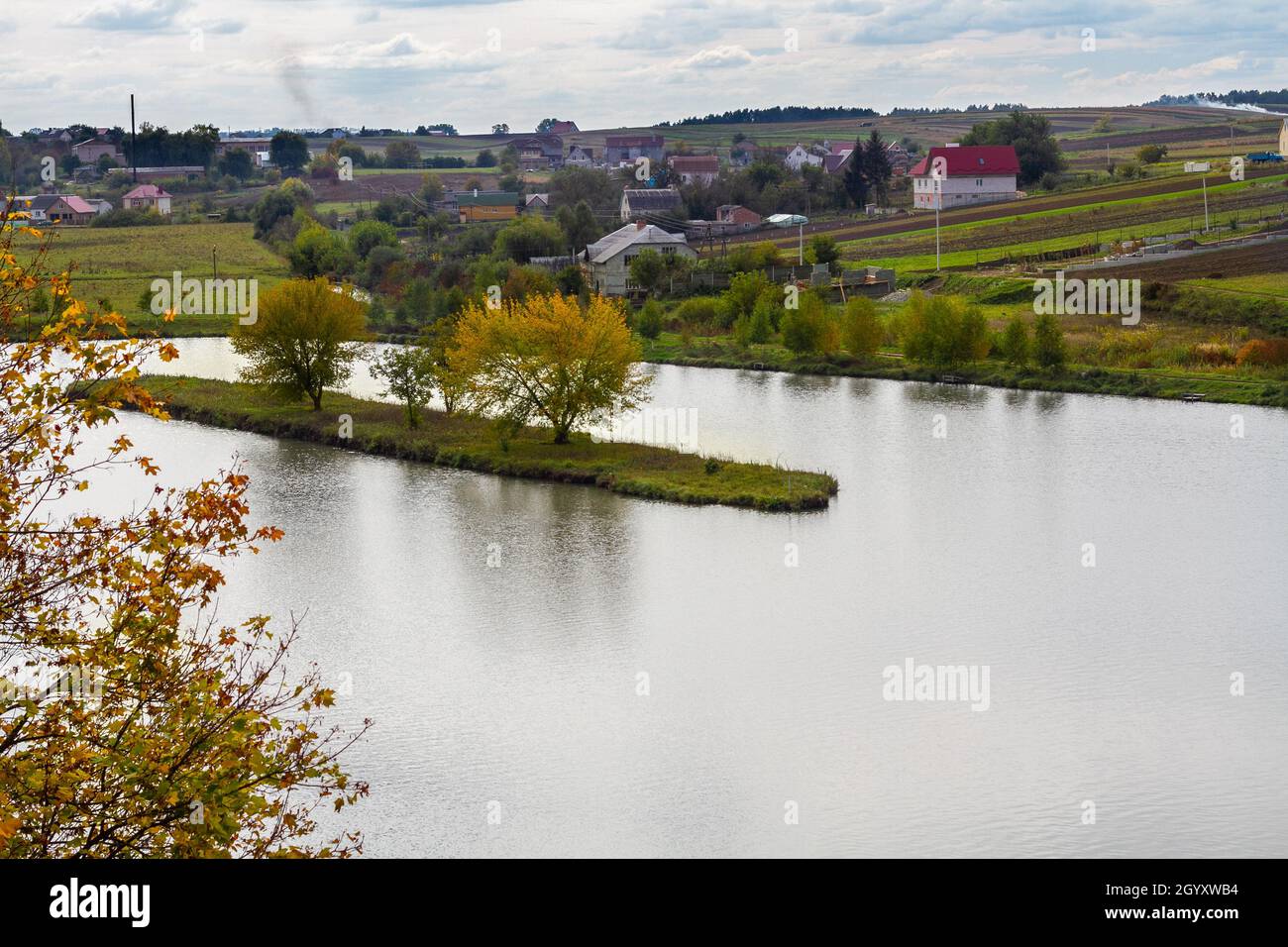 Rural ukrainian landscape. Colorful autumn scenery with village near ...