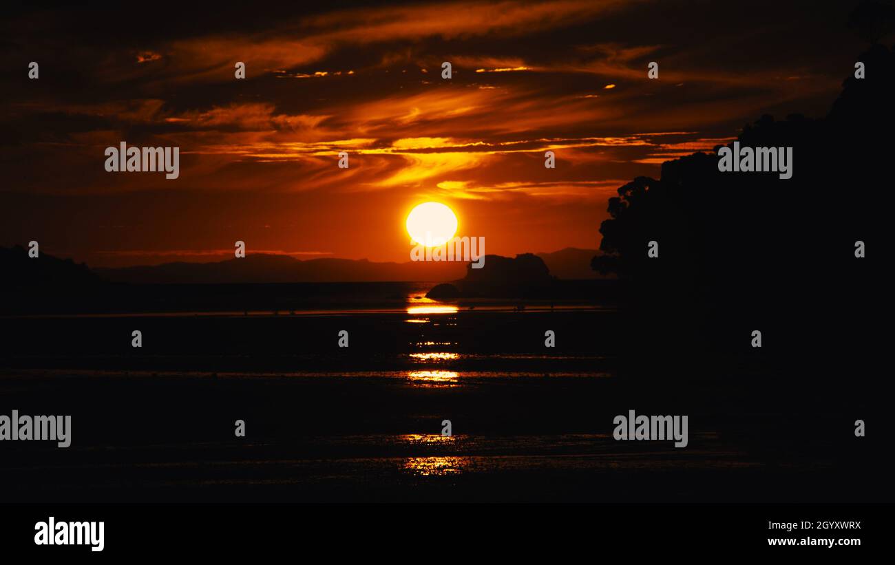 Sunset over the ocean in Coromandel Stock Photo - Alamy