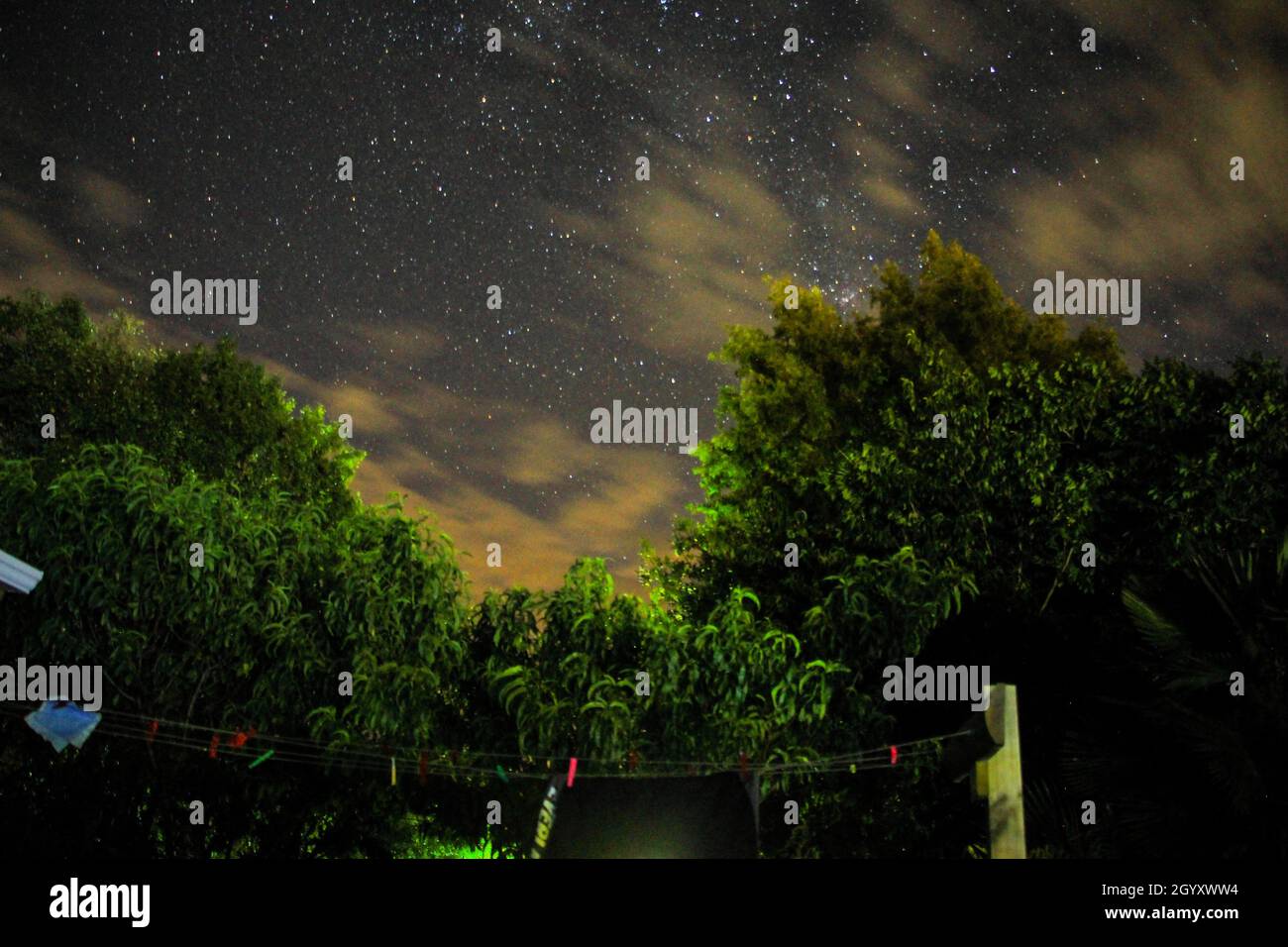 Starry sky at night with clouds Stock Photo - Alamy