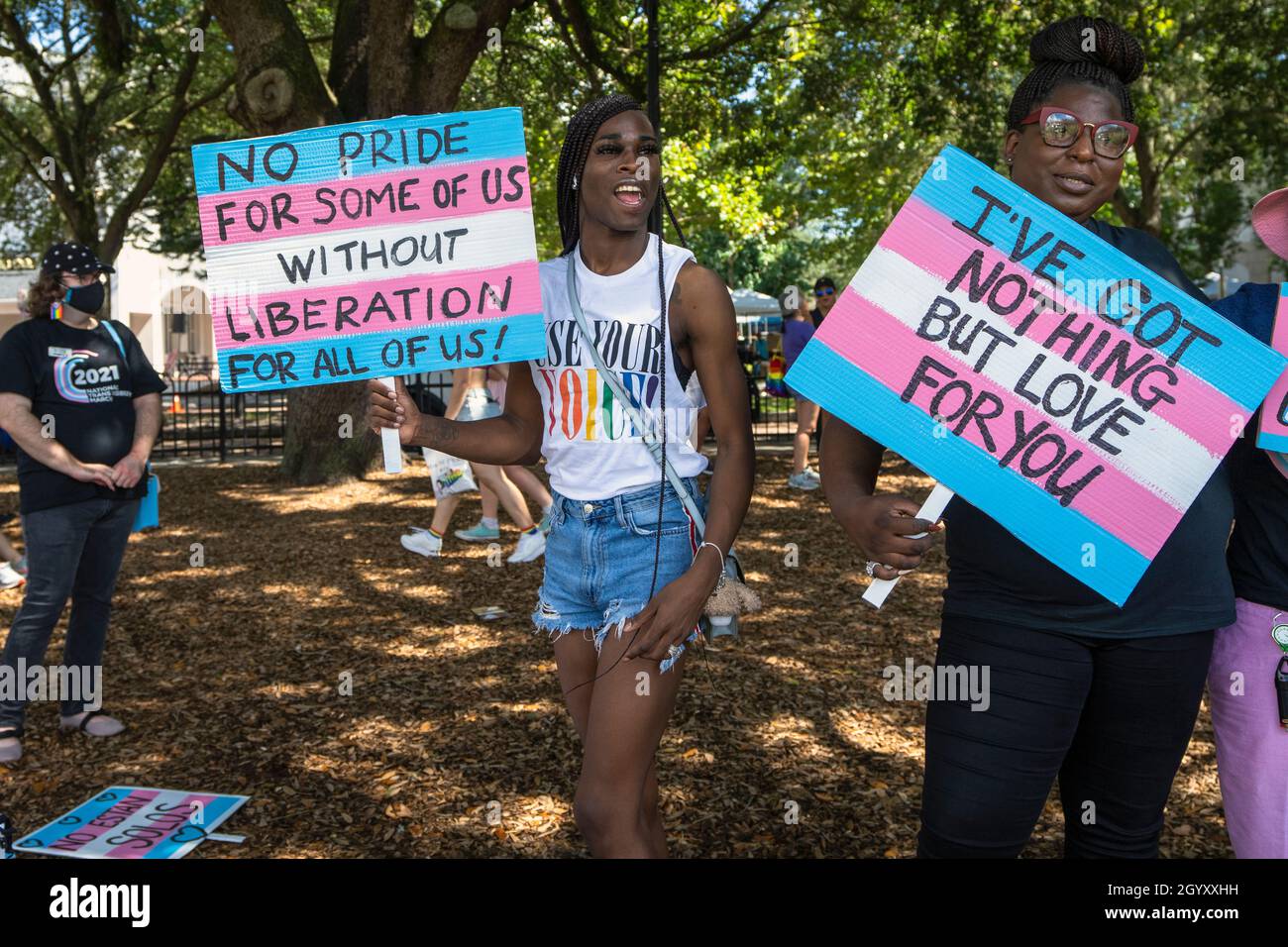 Orlando, United States. 09th Oct, 2021. Participants hold placards ...