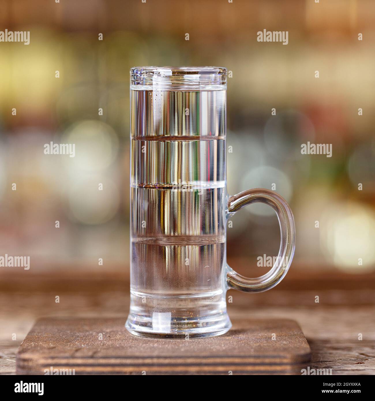 Multilayer cocktail Audi on the bar in a blurry background, space for ...