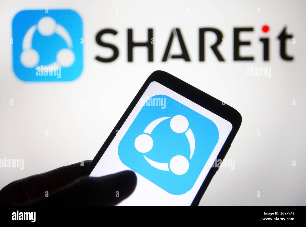 In this photo illustration a SHAREit logo is seen on a smartphone and a ...