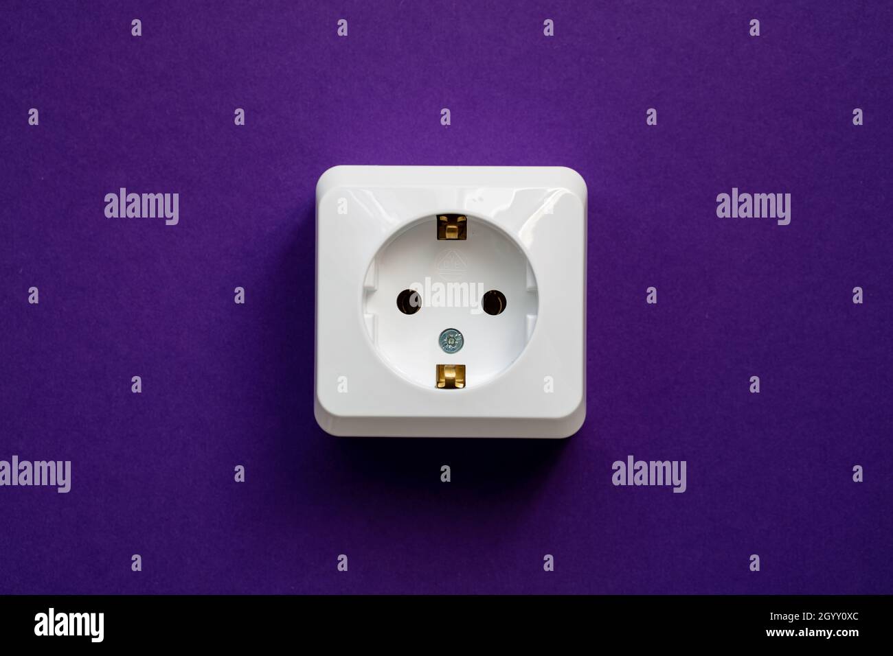 white socket isolated on purple background Stock Photo - Alamy