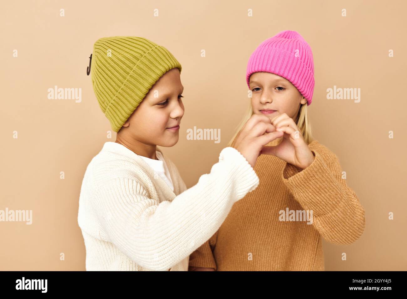 children together in multi-colored hats fun casual wear Studio Stock ...