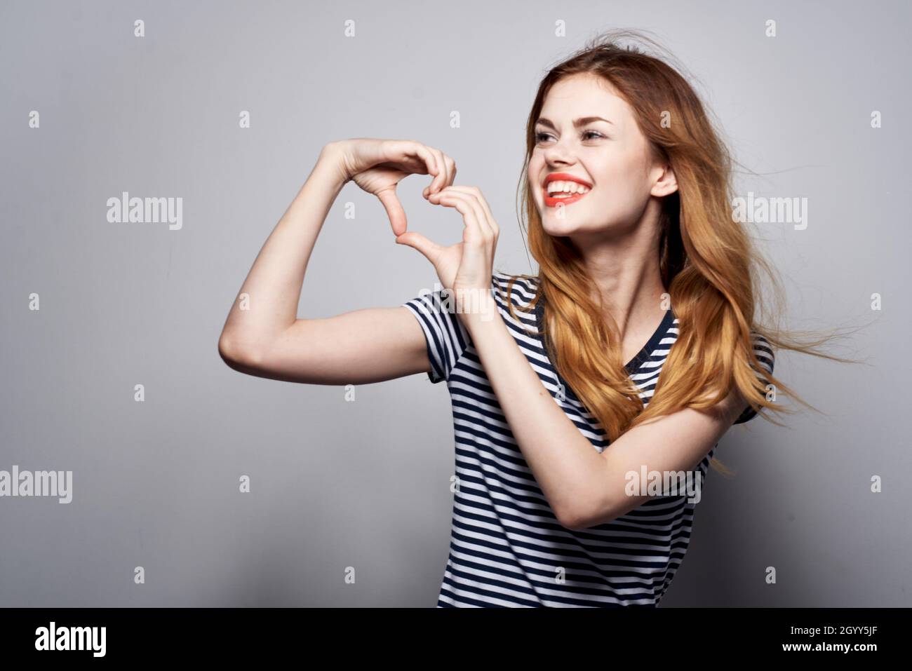 pretty woman holding hair makeup posing fun fashion model studio Stock ...