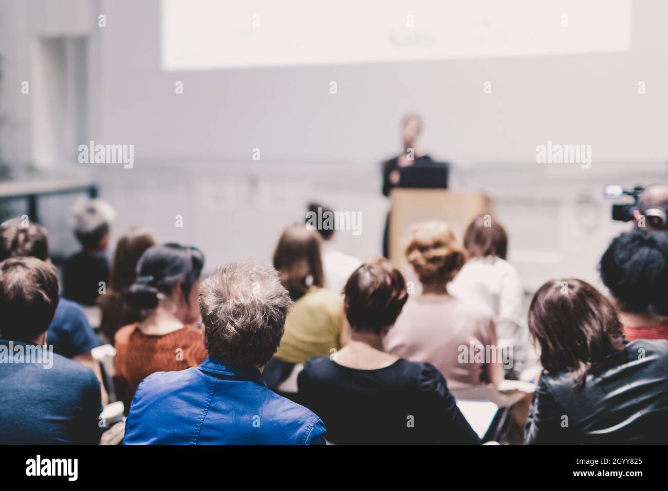 Woman giving presentation on business conference Stock Photo - Alamy