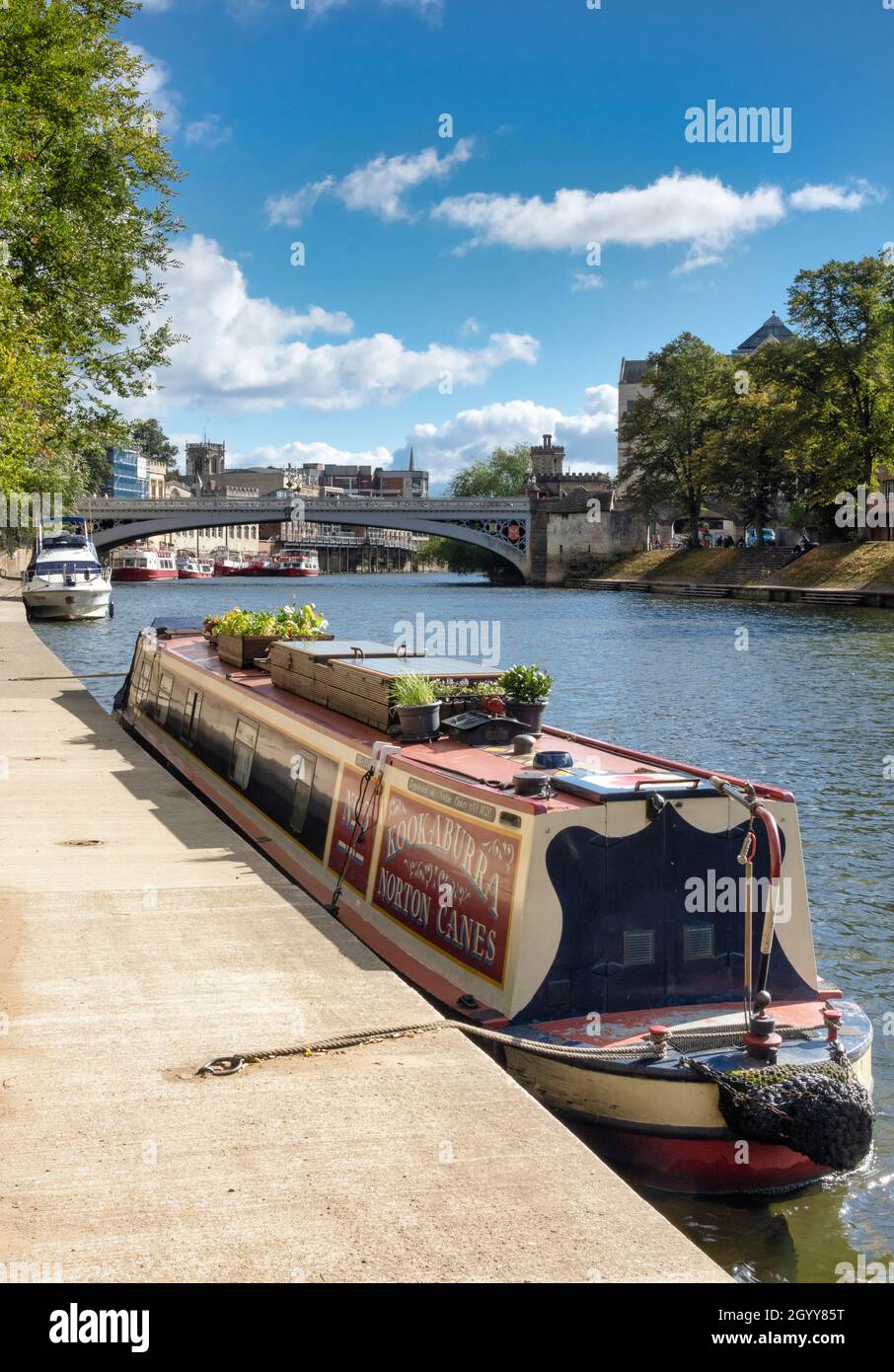 Lendale Bridge and a traditional barge moored on the River Ouse in York ...