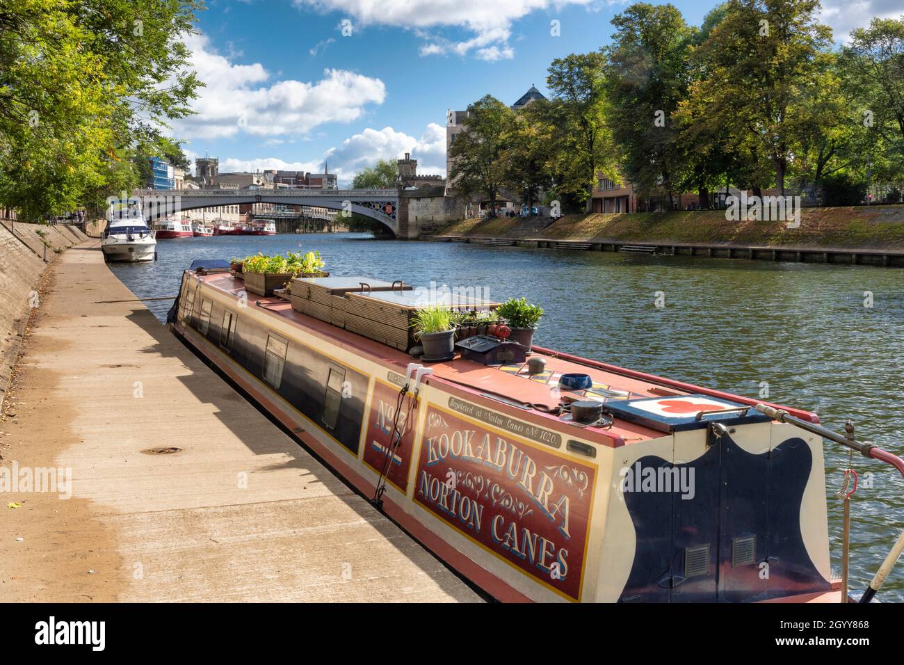 Lendale Bridge and a traditional barge moored on the River Ouse in York ...