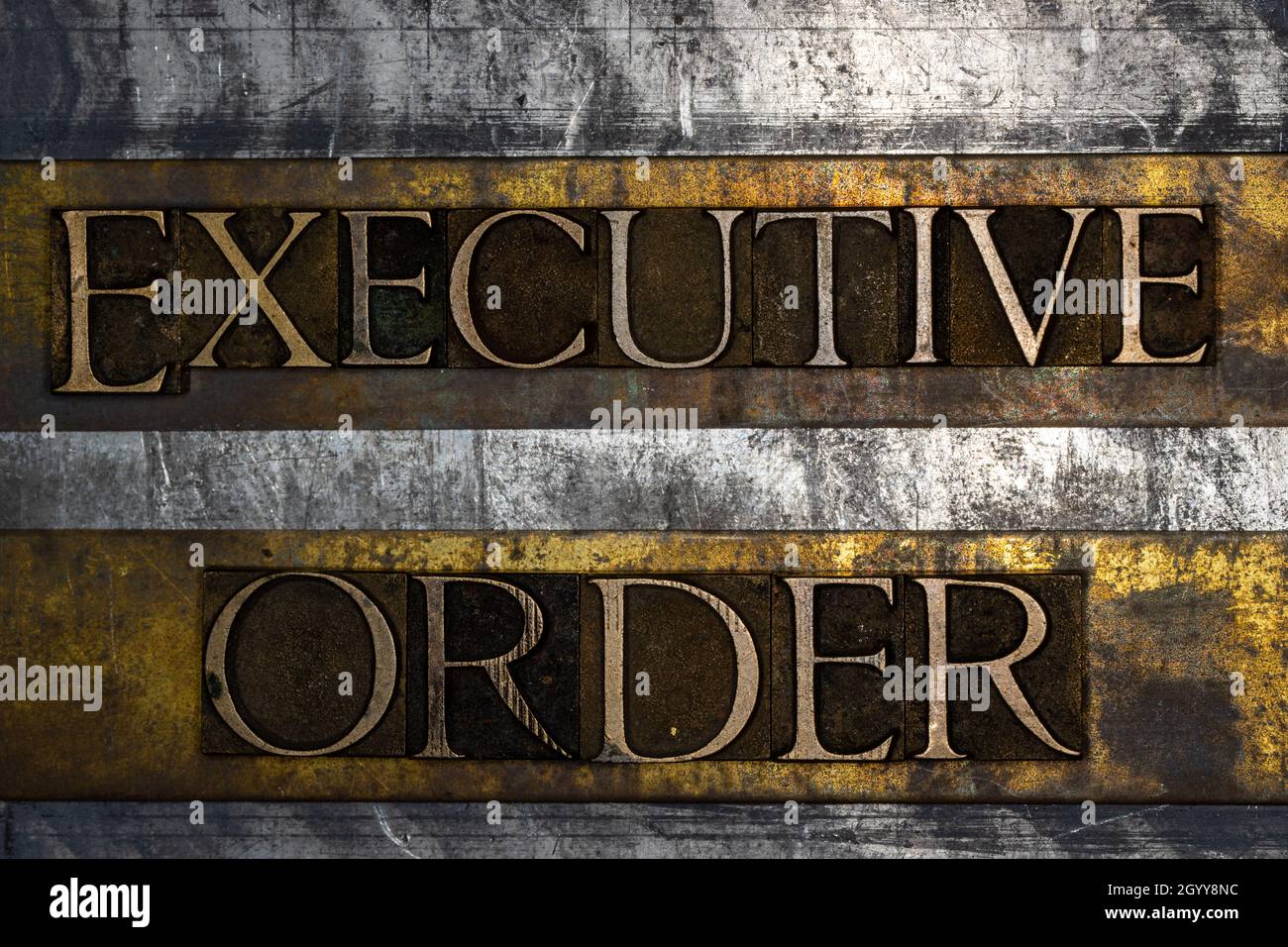 Executive Orders text on grunge textured copper and gold steampunk ...