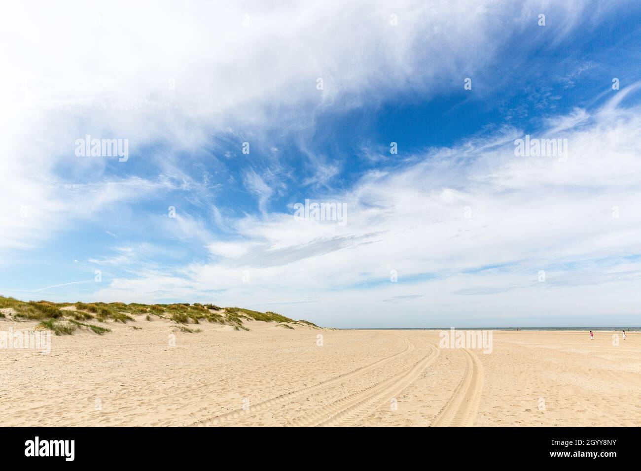 Blue sky and white clouds over a vast sandy beach Stock Photo - Alamy