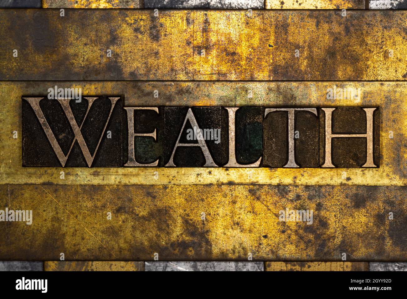 Wealth text on textured grunge copper and vintage gold background Stock ...