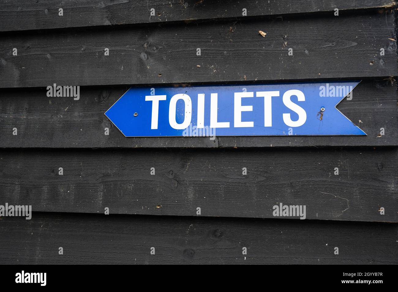 Wooden toilet sign arrow in hi-res stock photography and images - Alamy