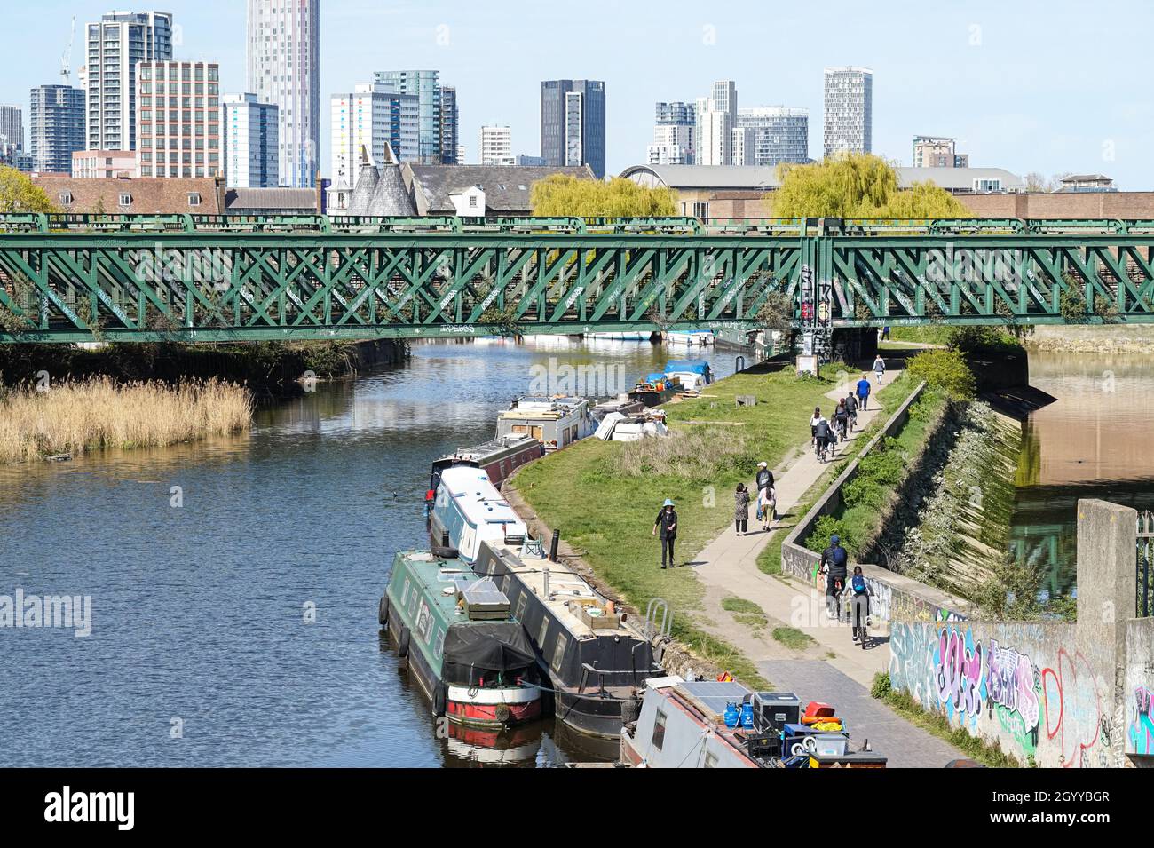 People enjoying sunny weather along the River Lea, London England ...