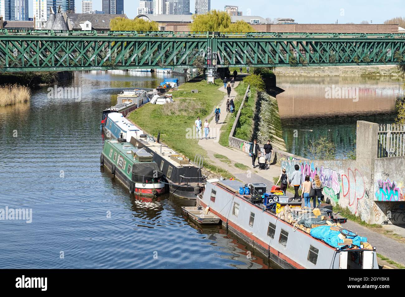 People enjoying sunny weather along the River Lea, London England ...