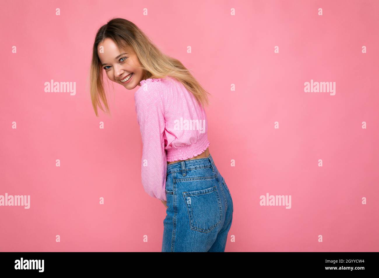 Young beautiful woman. Trendy woman in fashionable pink crop top ...