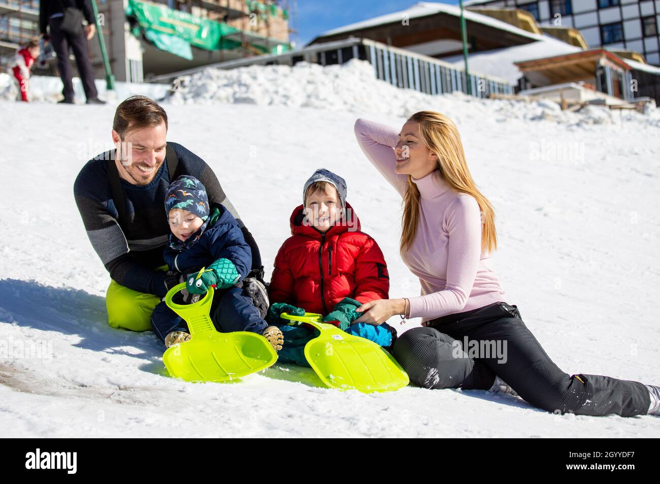 Parents with children playing on snow. Family winter vacation Stock ...