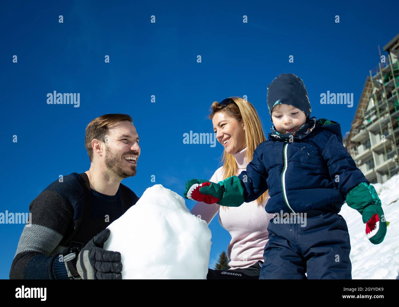 Parent kid playing snow making hi-res stock photography and images - Alamy