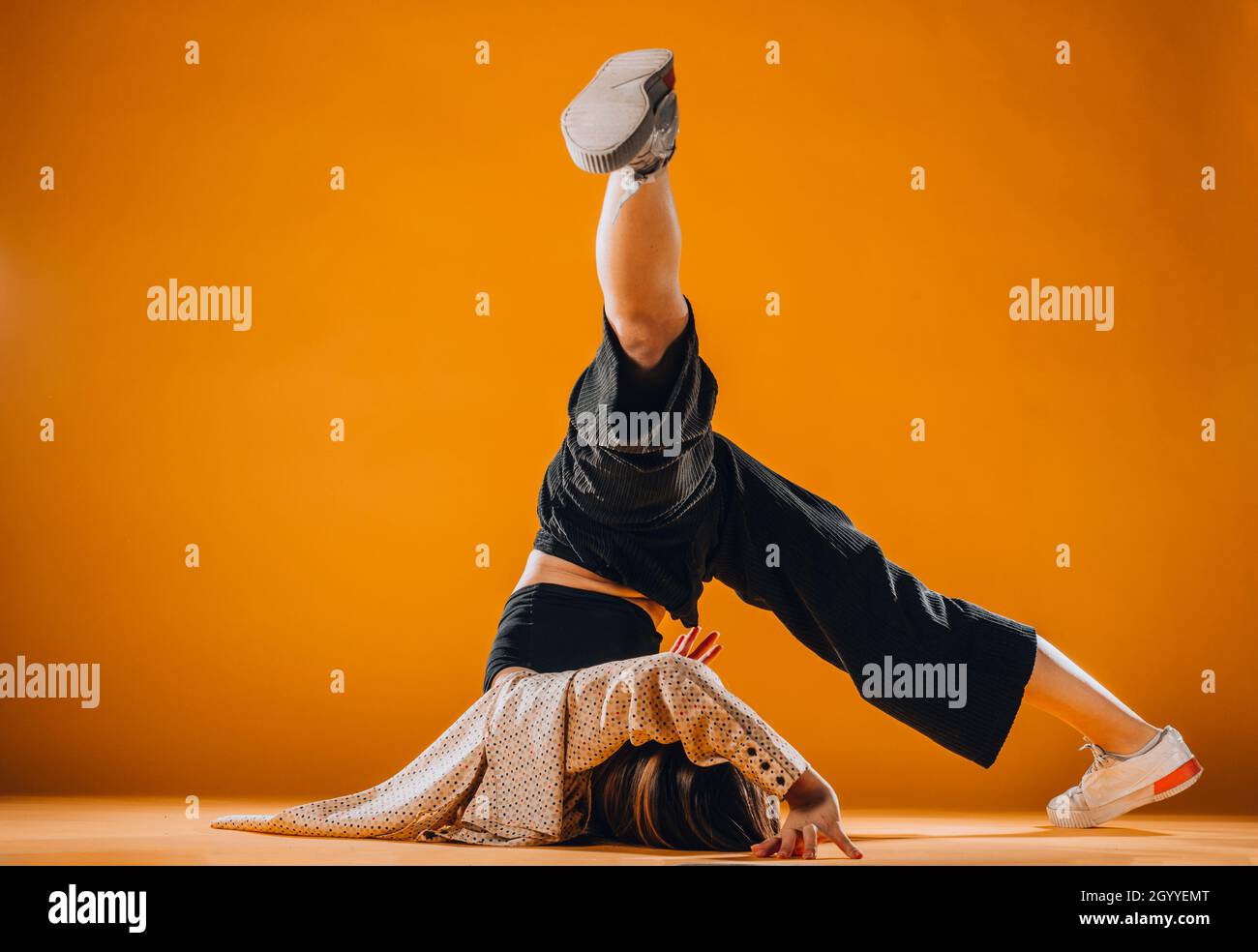 Slender flexible dance performer during a dance practice in modern ...