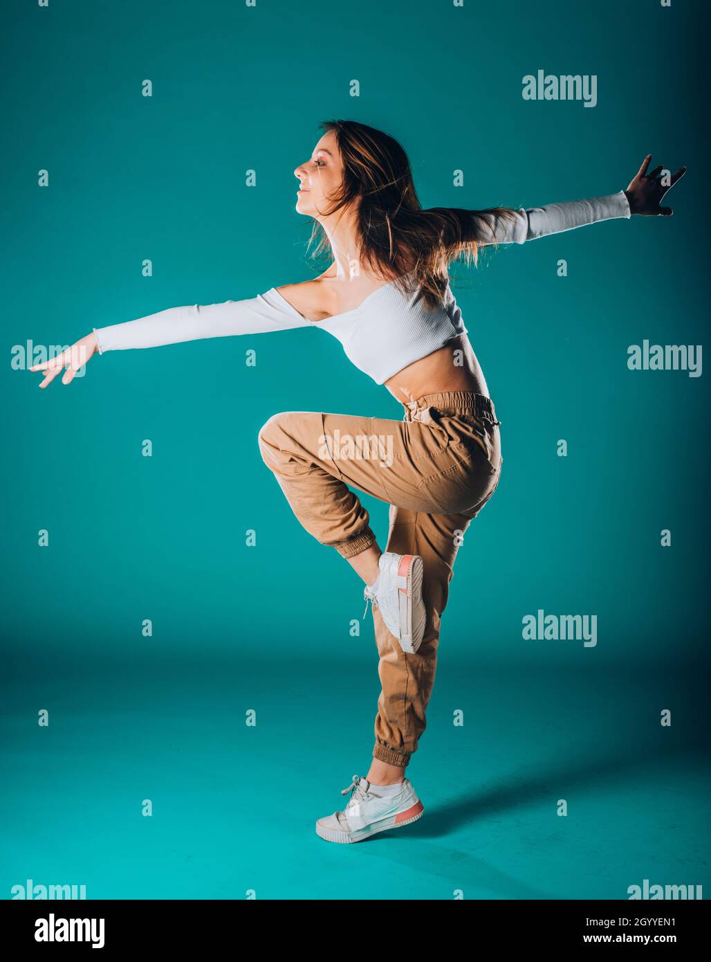 Dance moves performed by an acrobatic flexible female dancer dancing in ...