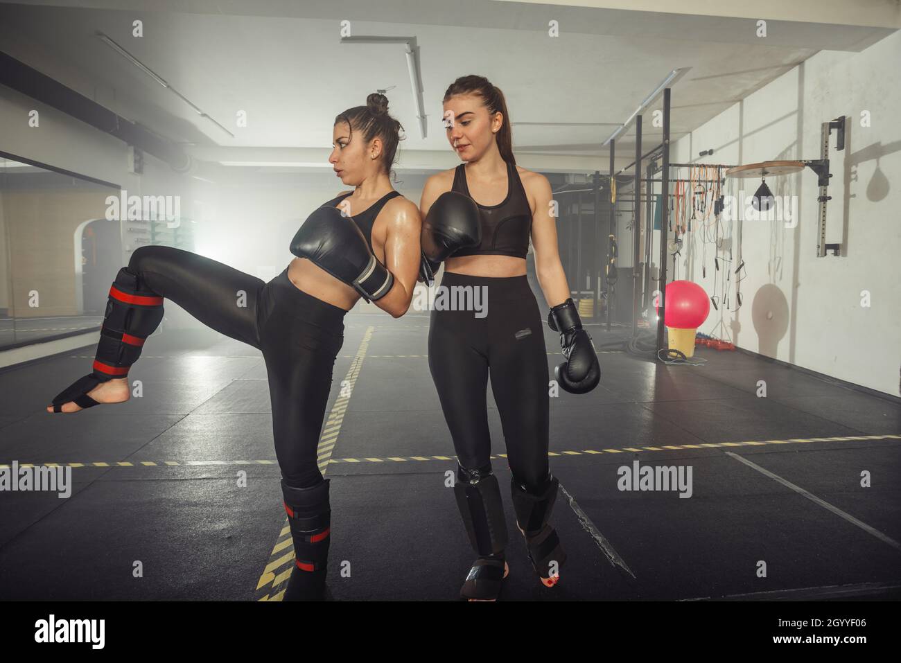 Female kickboxer doing a side kick Stock Photo - Alamy