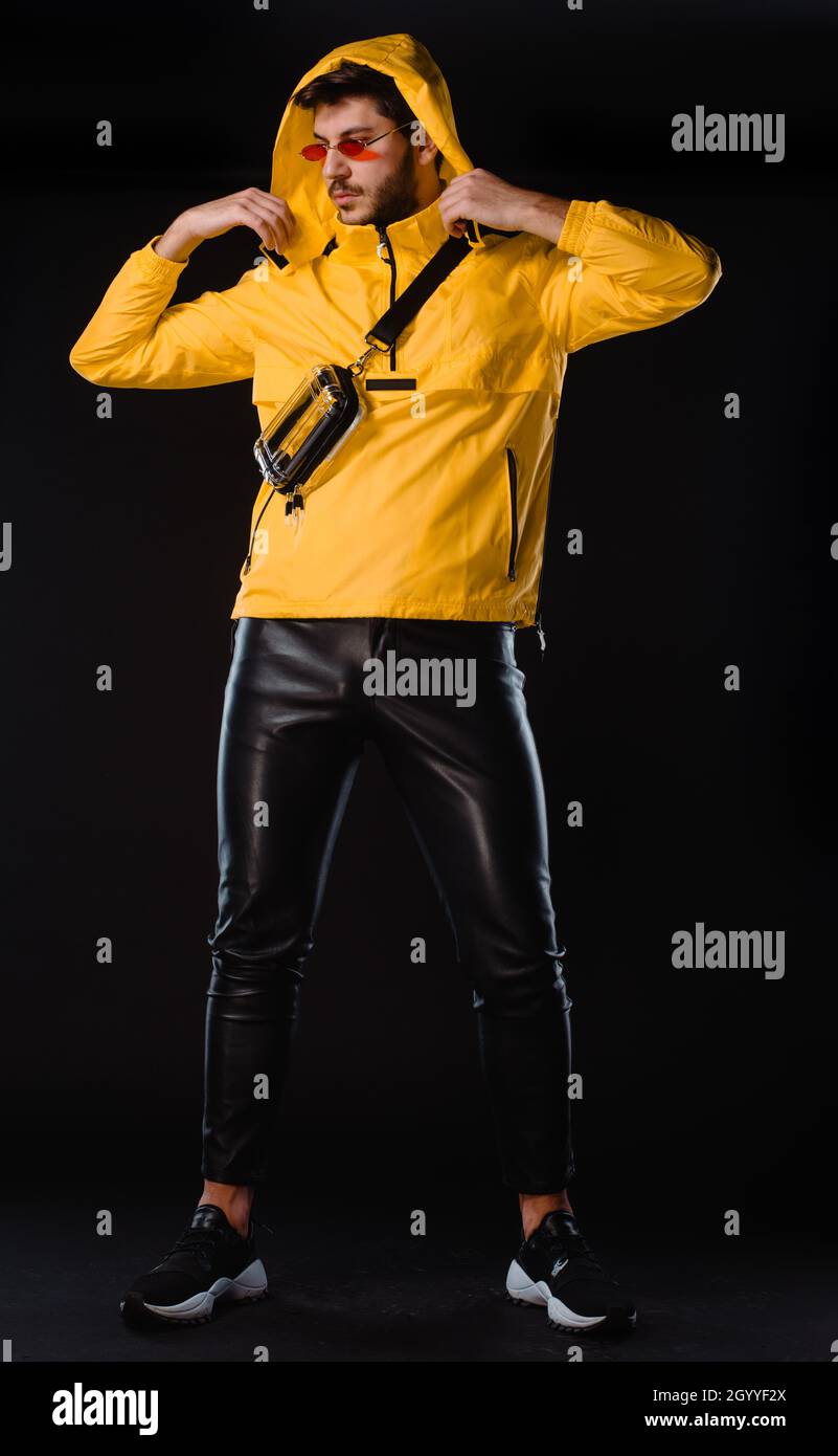 Portrait of an attractive young guy posing in modern style clothes ...